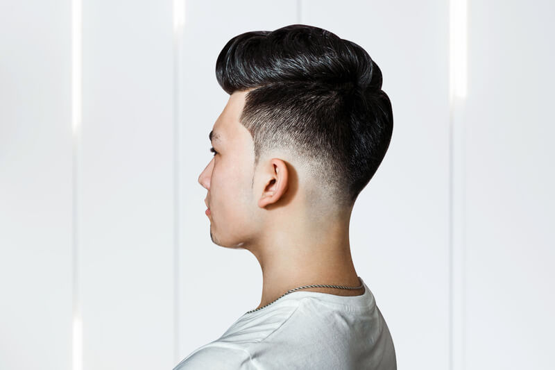Wat is een pompadour kapsel? Wat is een pompadour cut?
